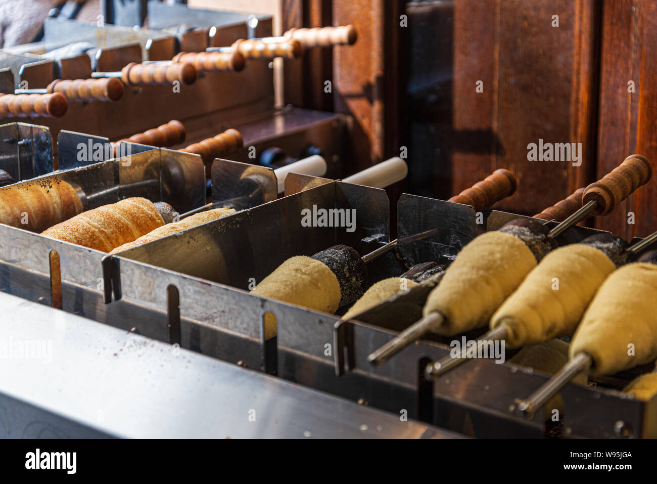 Making process of Trdelník, traditional sweet pastry which is bread ...