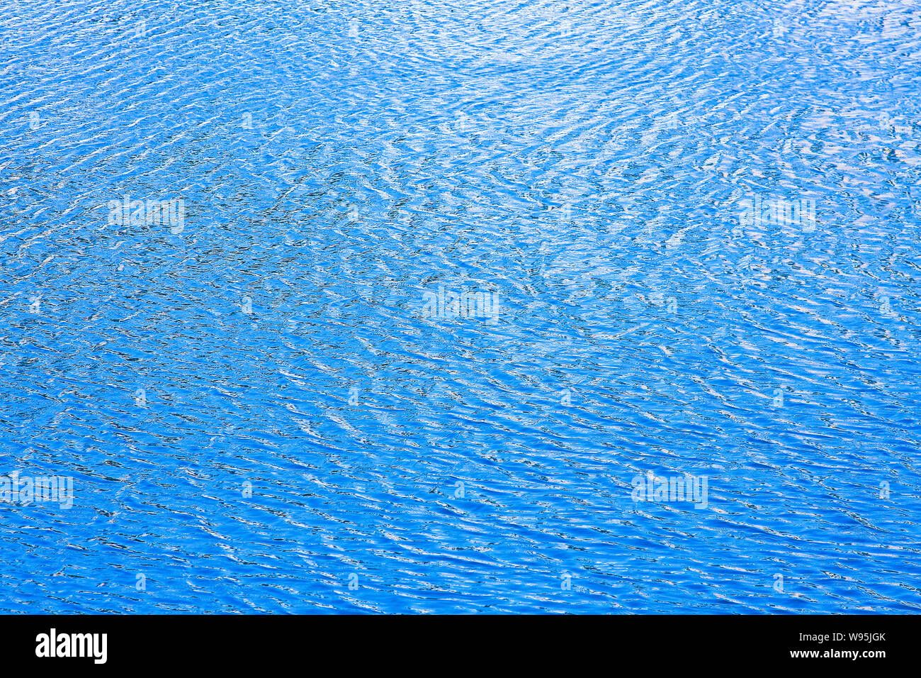 Big body of blue clean water texture Stock Photo - Alamy