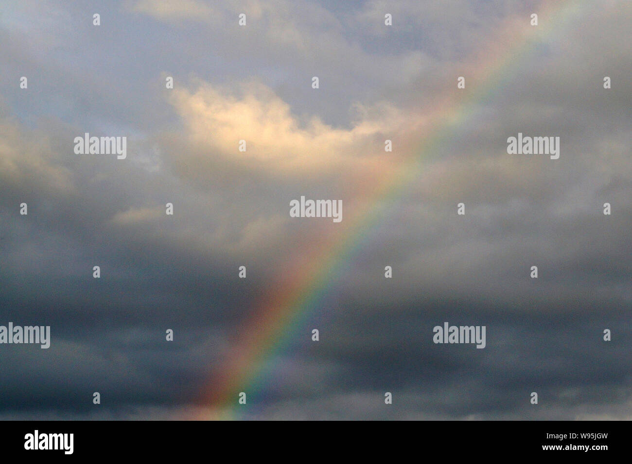 Beautiful rainbow on a cloudy sky after rain. Environment Stock Photo ...