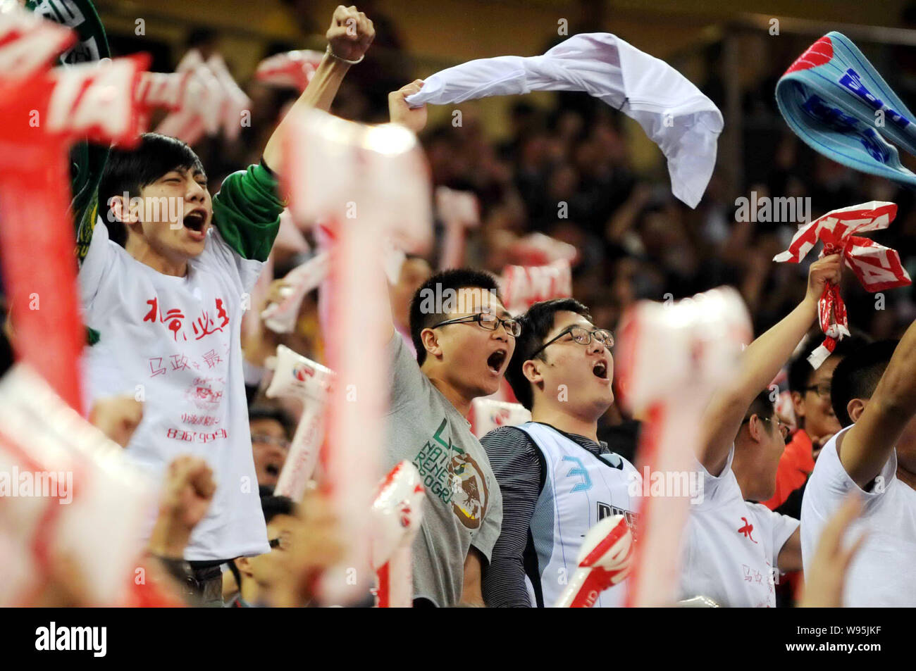 Chinese basketball fans cheer to show support for Beijing Ducks in the ...