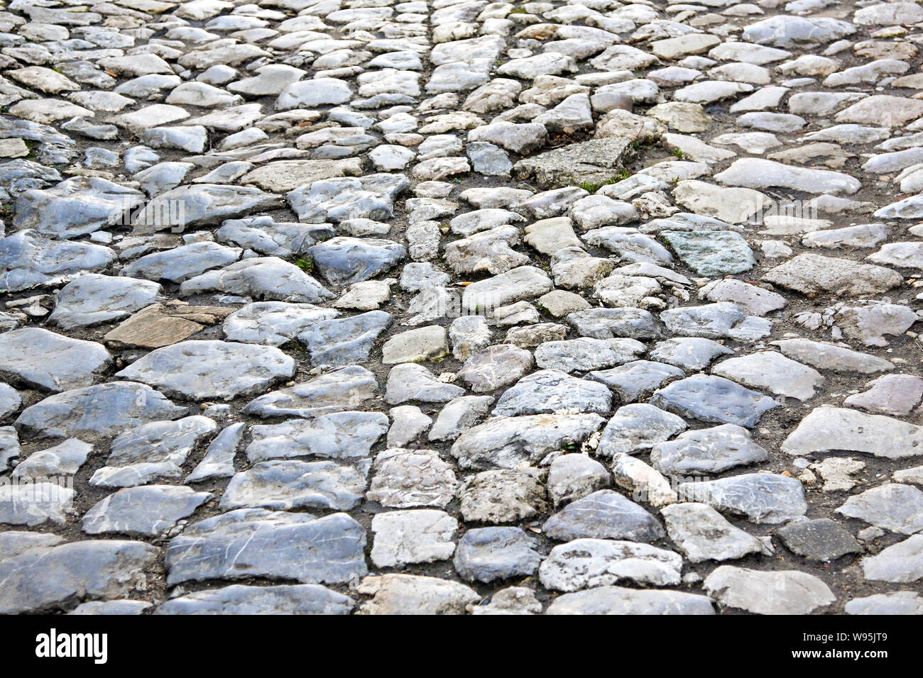 Detailed texture of rough terrain cobble road Stock Photo - Alamy