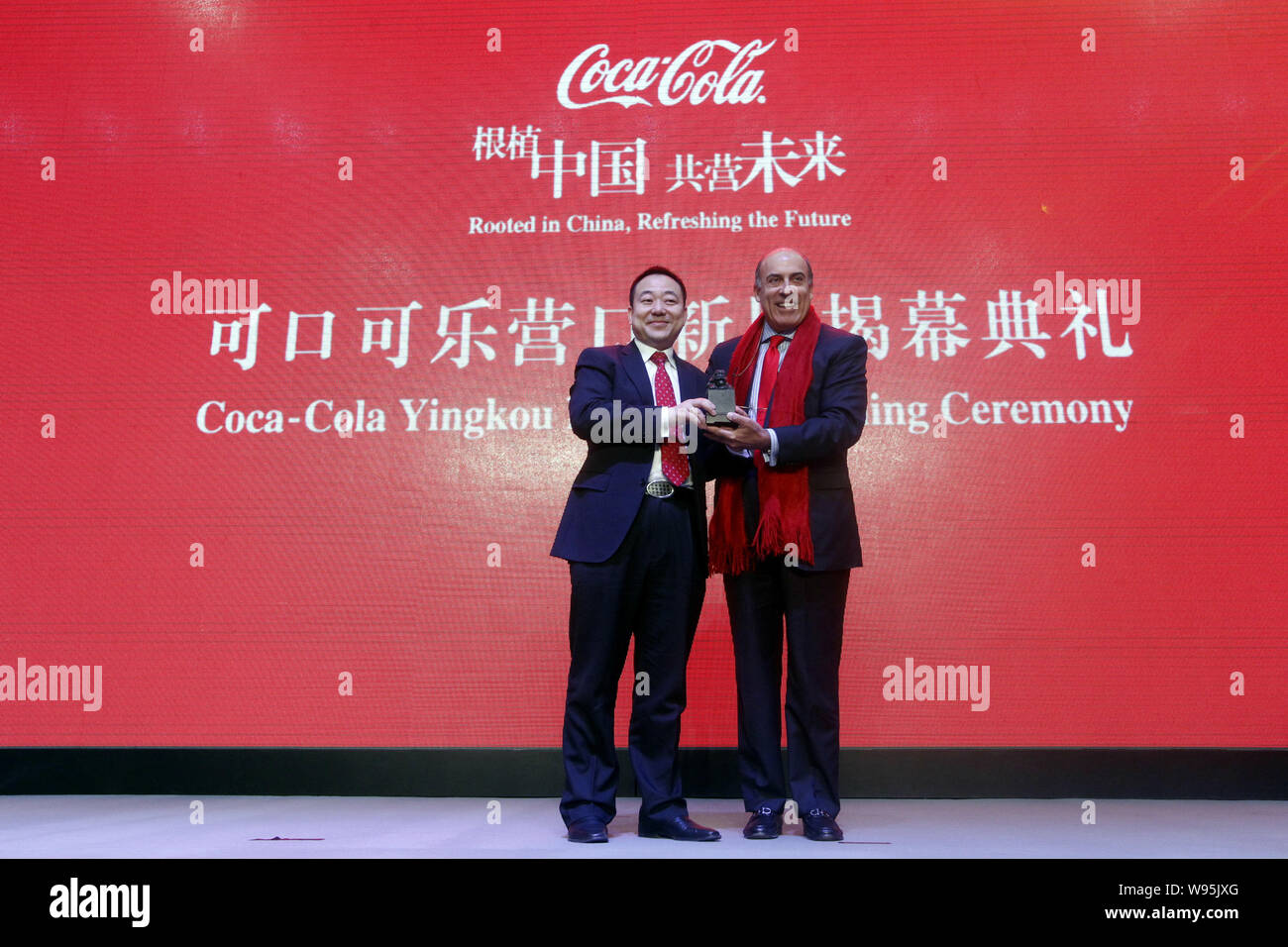 Muhtar Kent, right, Chairman and CEO of The Coca-Cola Company, attends ...