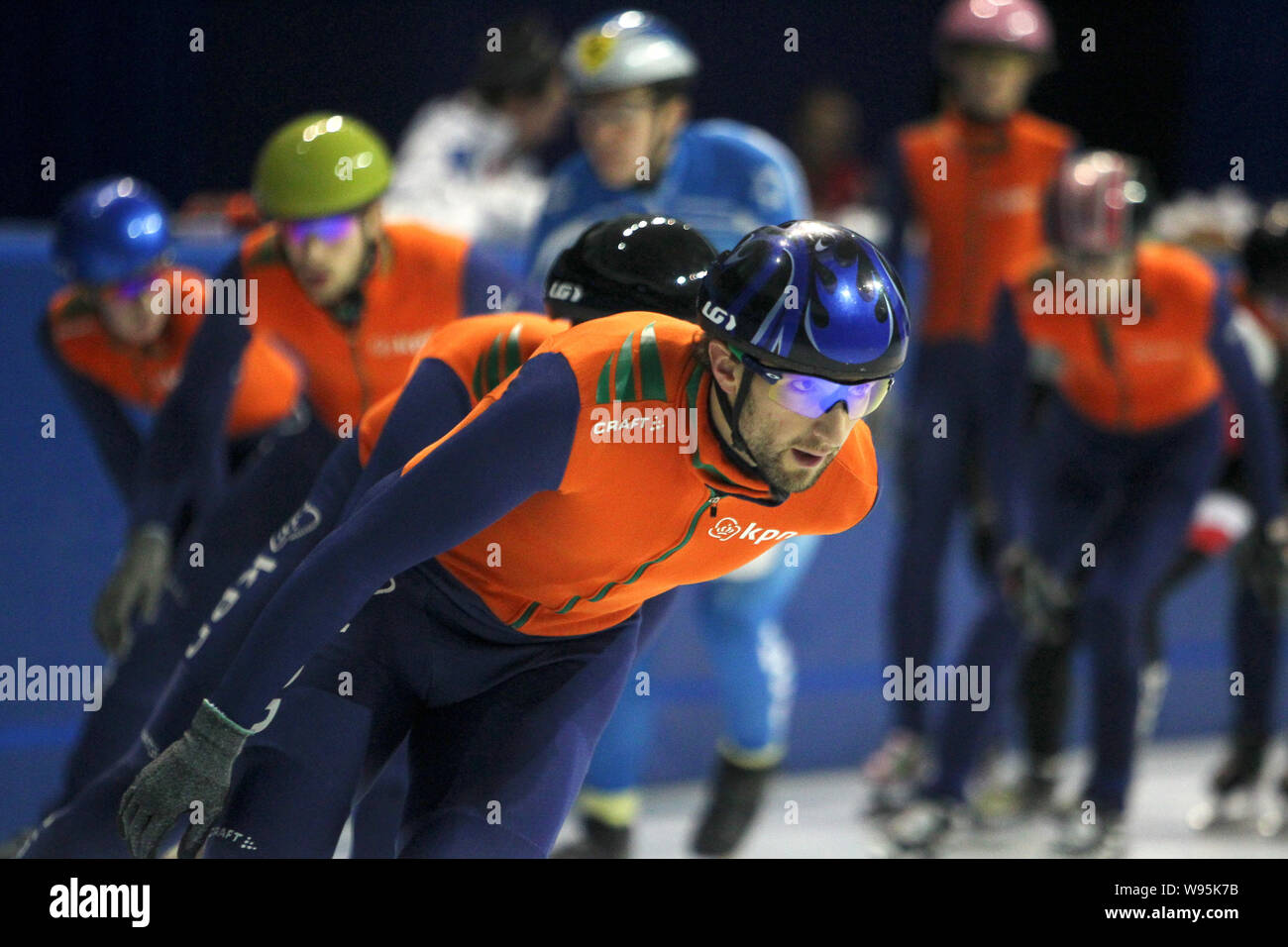 Members of the Dutch short track speed skating team exercise during a ...