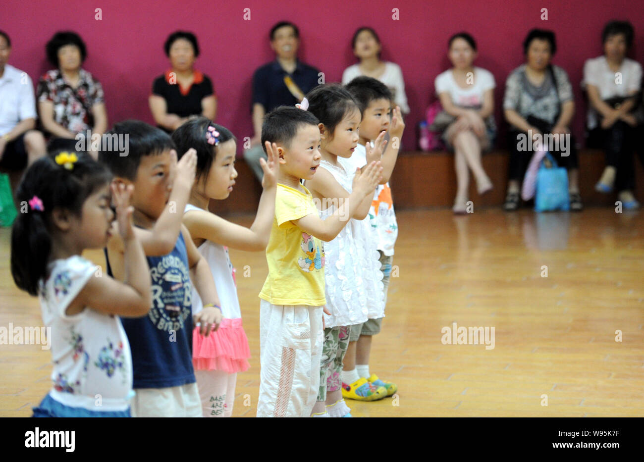 Young Chinese kids learn Latin dance at a training center during the ...