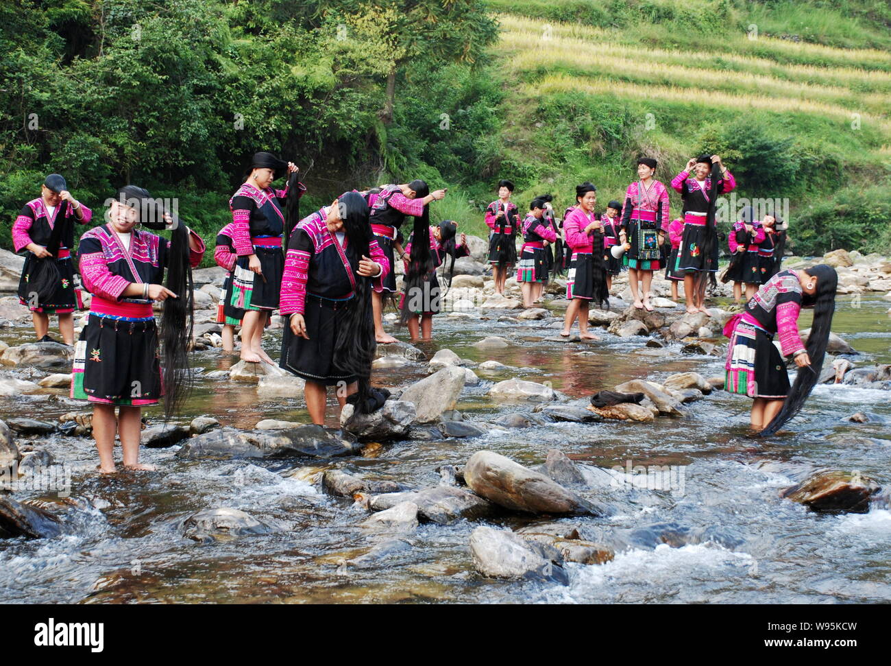 Women of Red Yao minority ethnic group wash their long hair in the ...