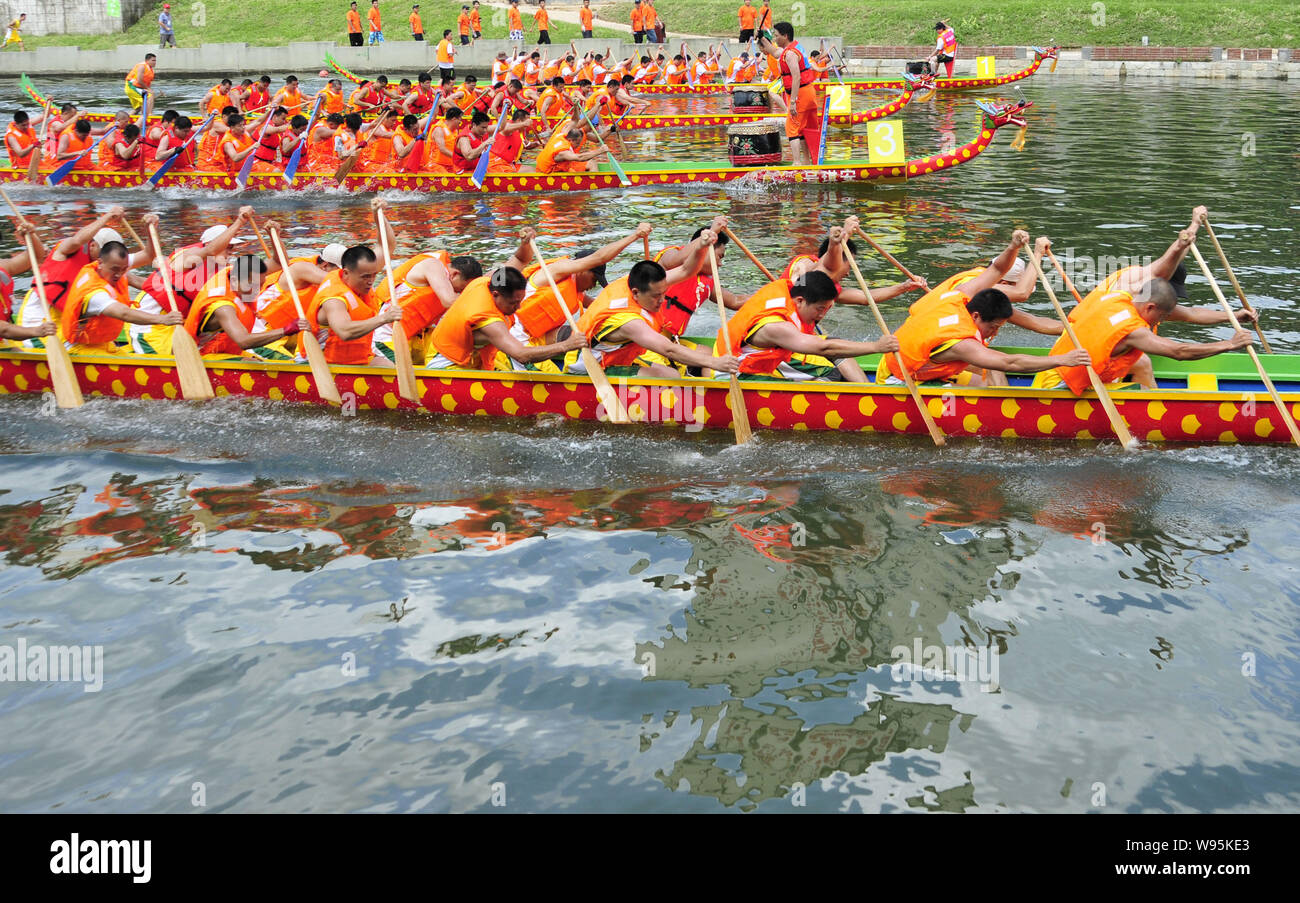 Chinese participants compete in a dragon boat race to celebrate the ...