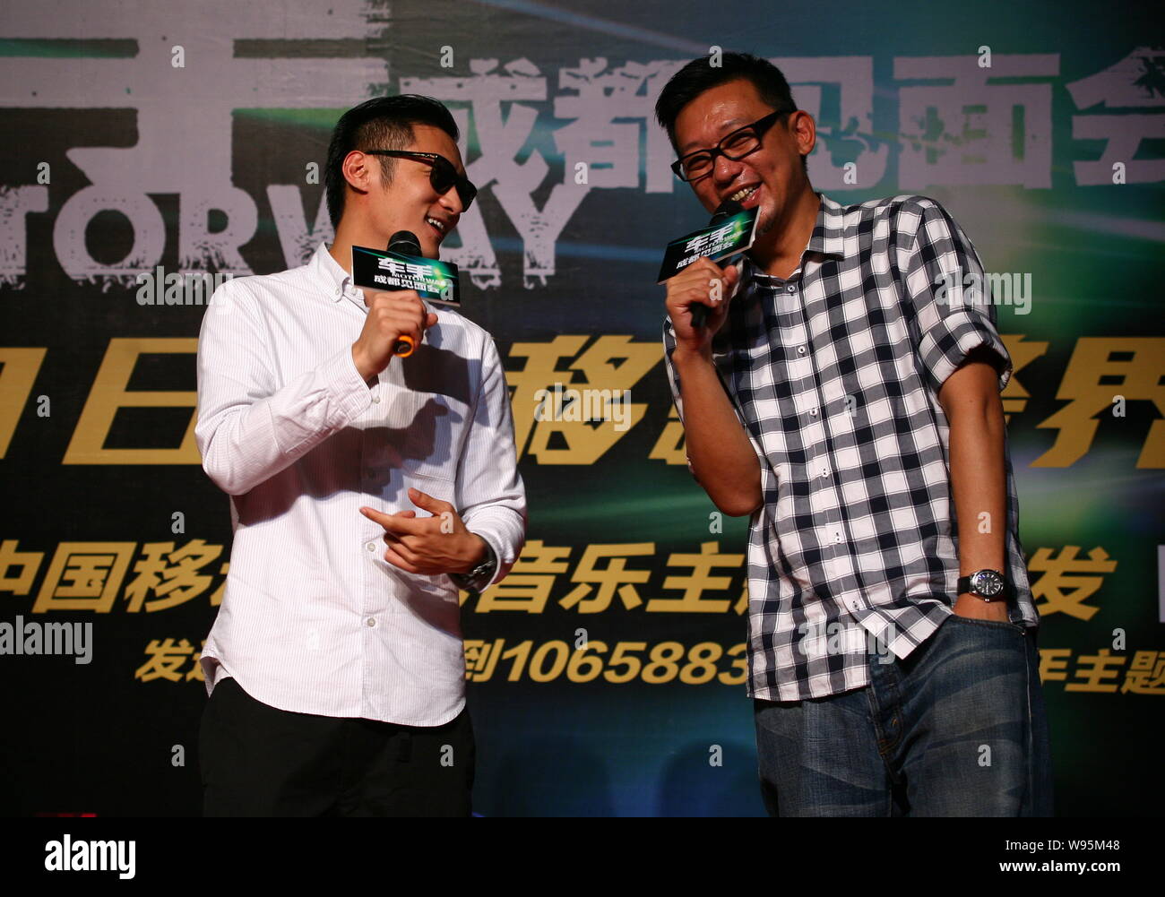 Hong Kong actor Shawn Yue (L) and director Cheang Pou-Soi speak during ...