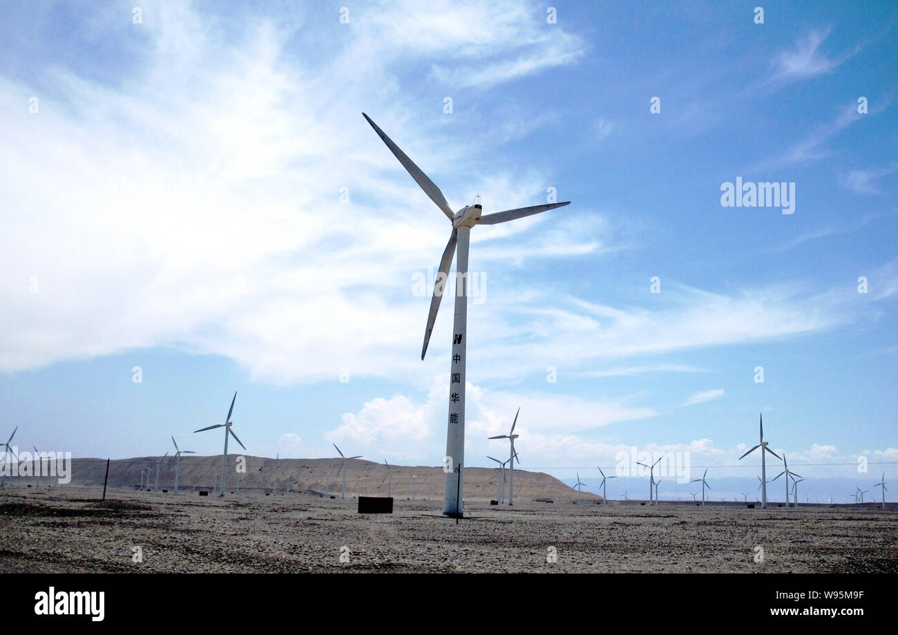 --FILE--Wind turbines whirl to generate electricity at a wind farm in ...