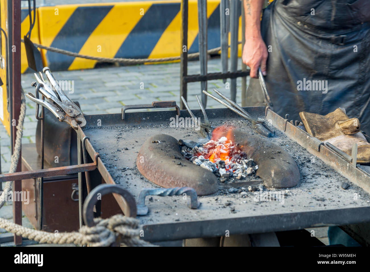 Blacksmith forge work at the outdoor market in old town square in ...
