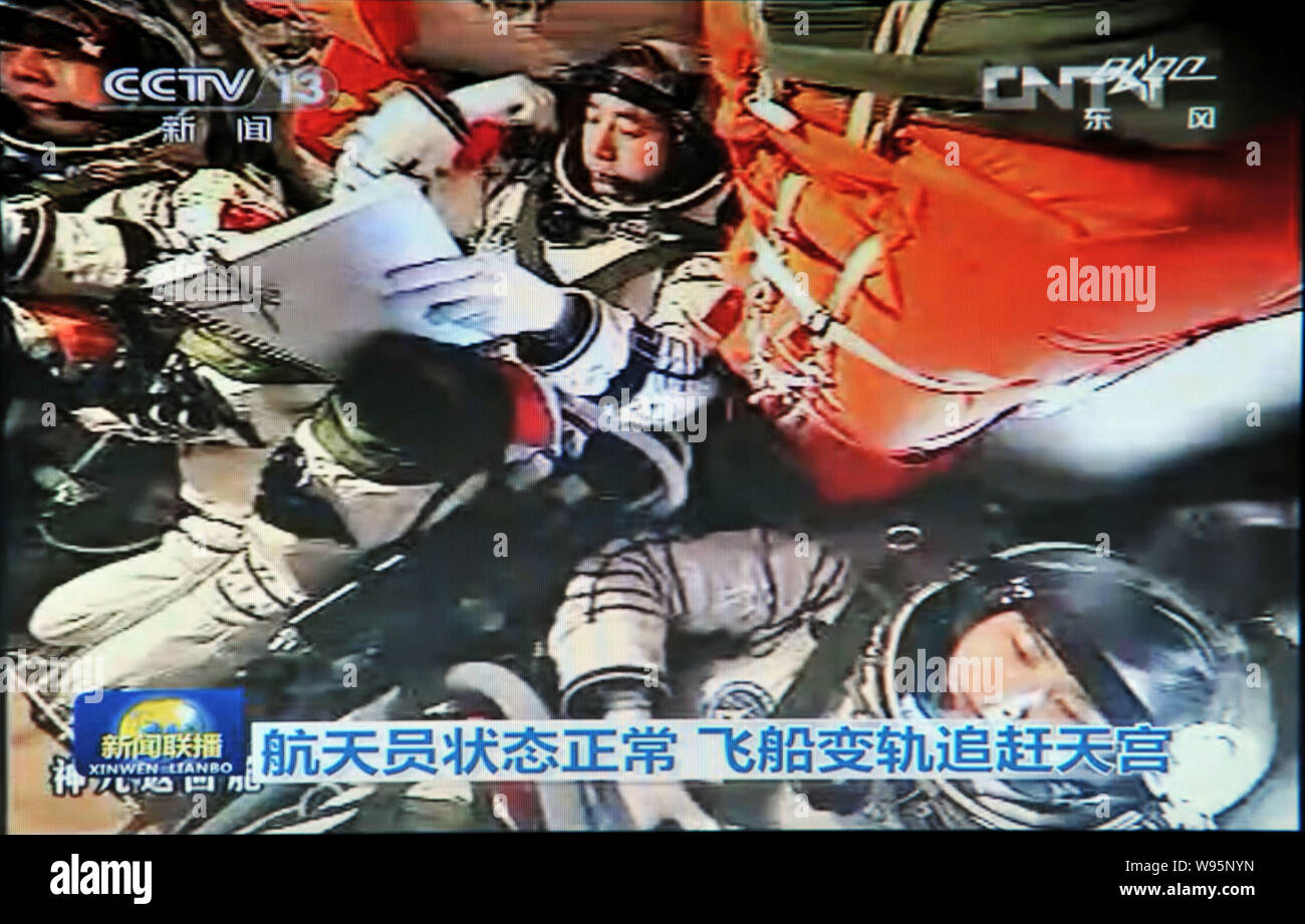 This TV grab shows Chinese astronauts (from left) Liu Wang, Jing ...