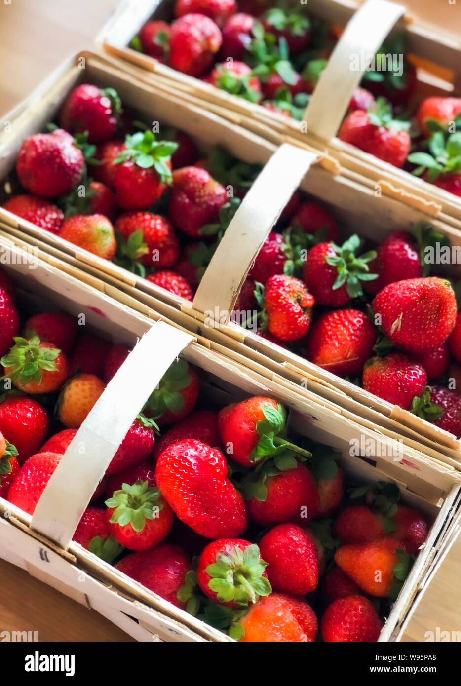 Three strawberry baskets Stock Photo - Alamy