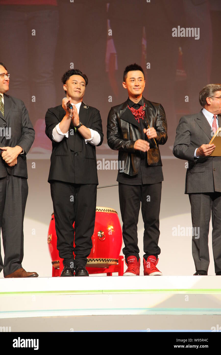 Hong Kong singer and actor Raymond Lam (R) and Eason Chan (L) attend ...