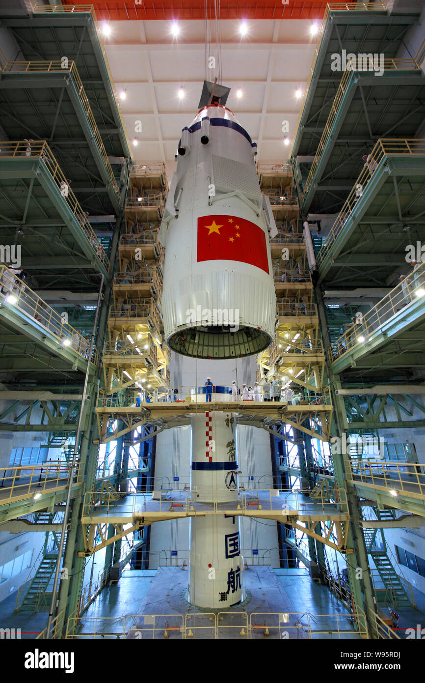 The Shenzhou-9 (Shenzhou IX) spacecraft is being lifted before being ...