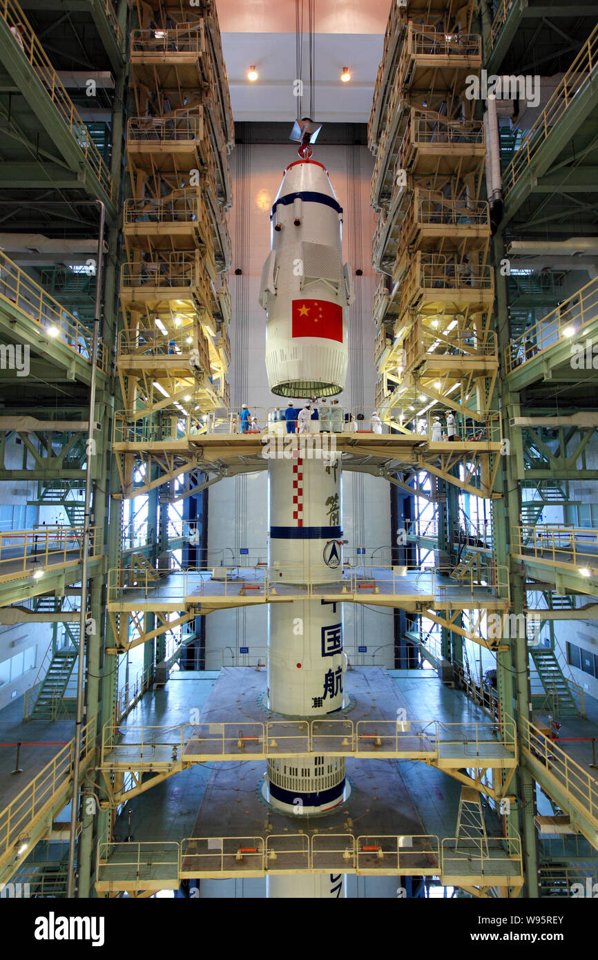The Shenzhou-9 (Shenzhou IX) spacecraft is being installed on a Long ...
