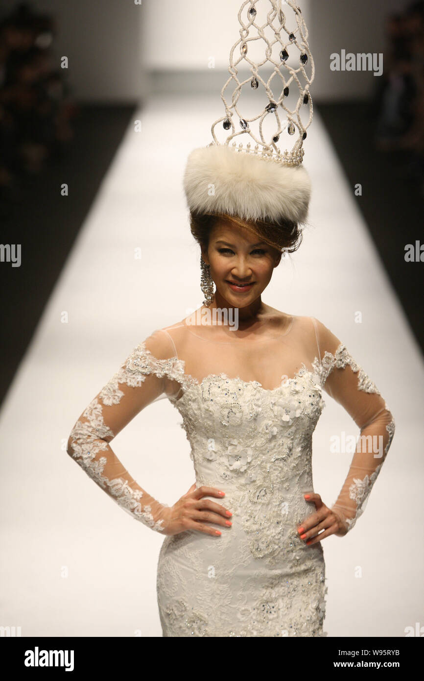 Chinese-American singer Coco Lee poses during the Dorian Ho fashion ...