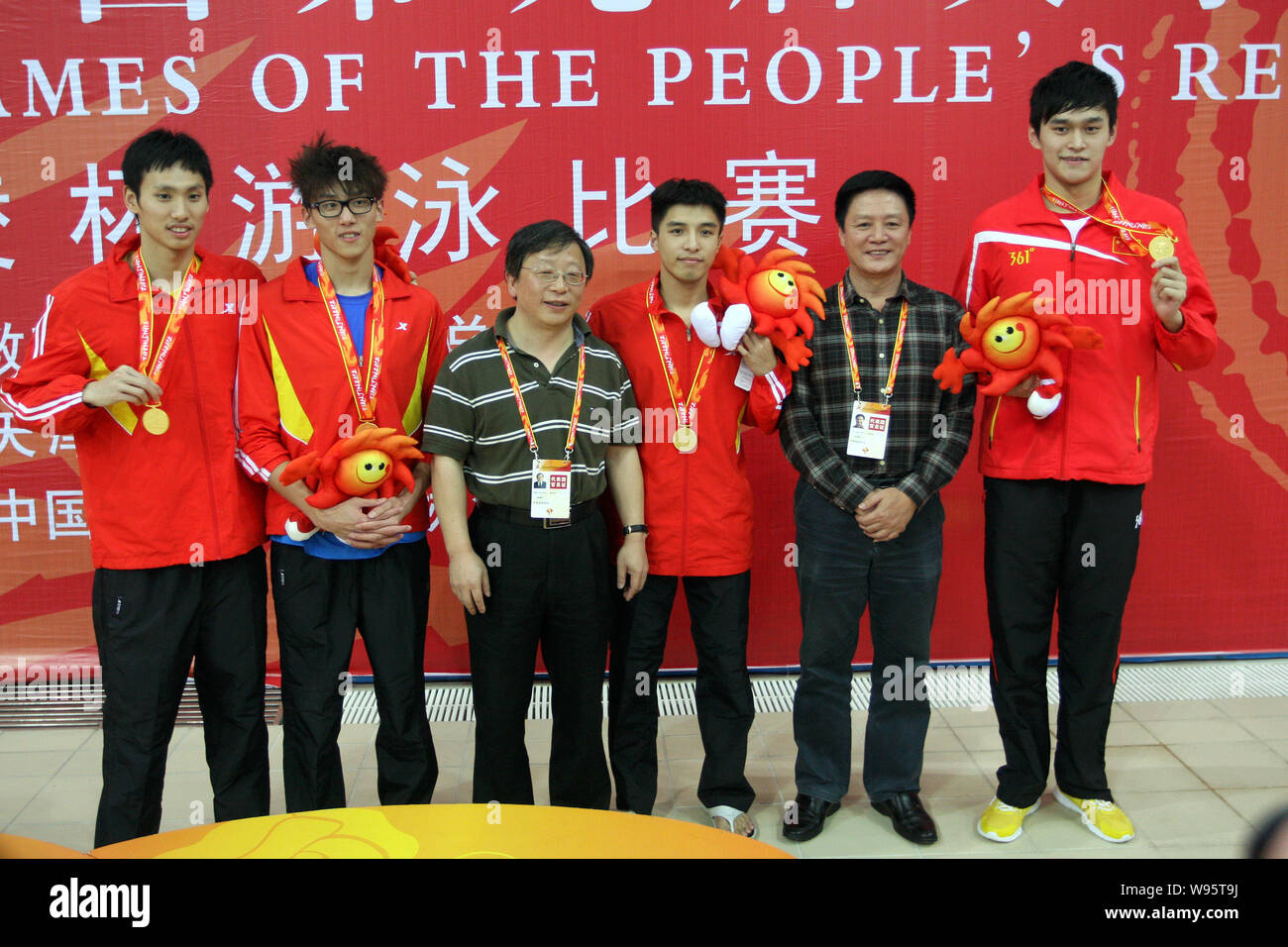 Chinese double swimming Olympic gold medalist Sun Yang (R) celebrates ...