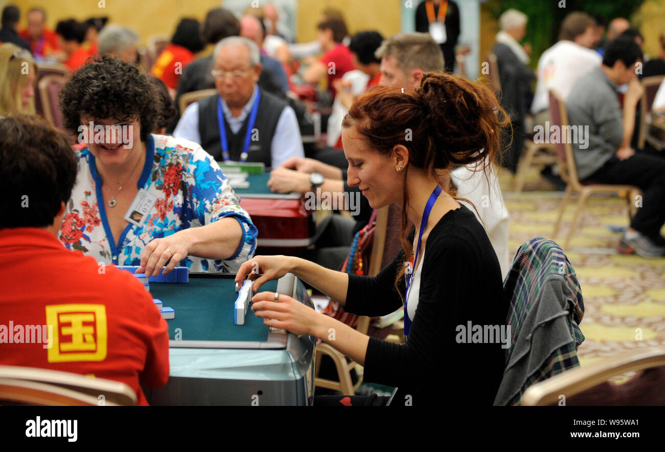 Participants compete during the 3rd World Mahjong Championship in ...