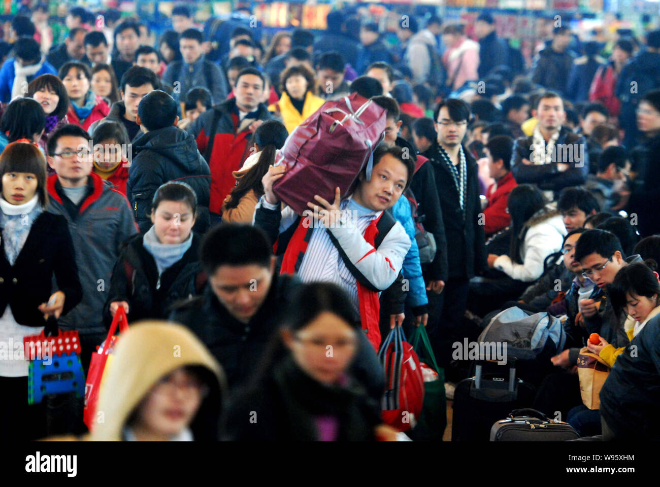 A crowd of Chinese passengers are pictured at the Jiujiang Railway ...