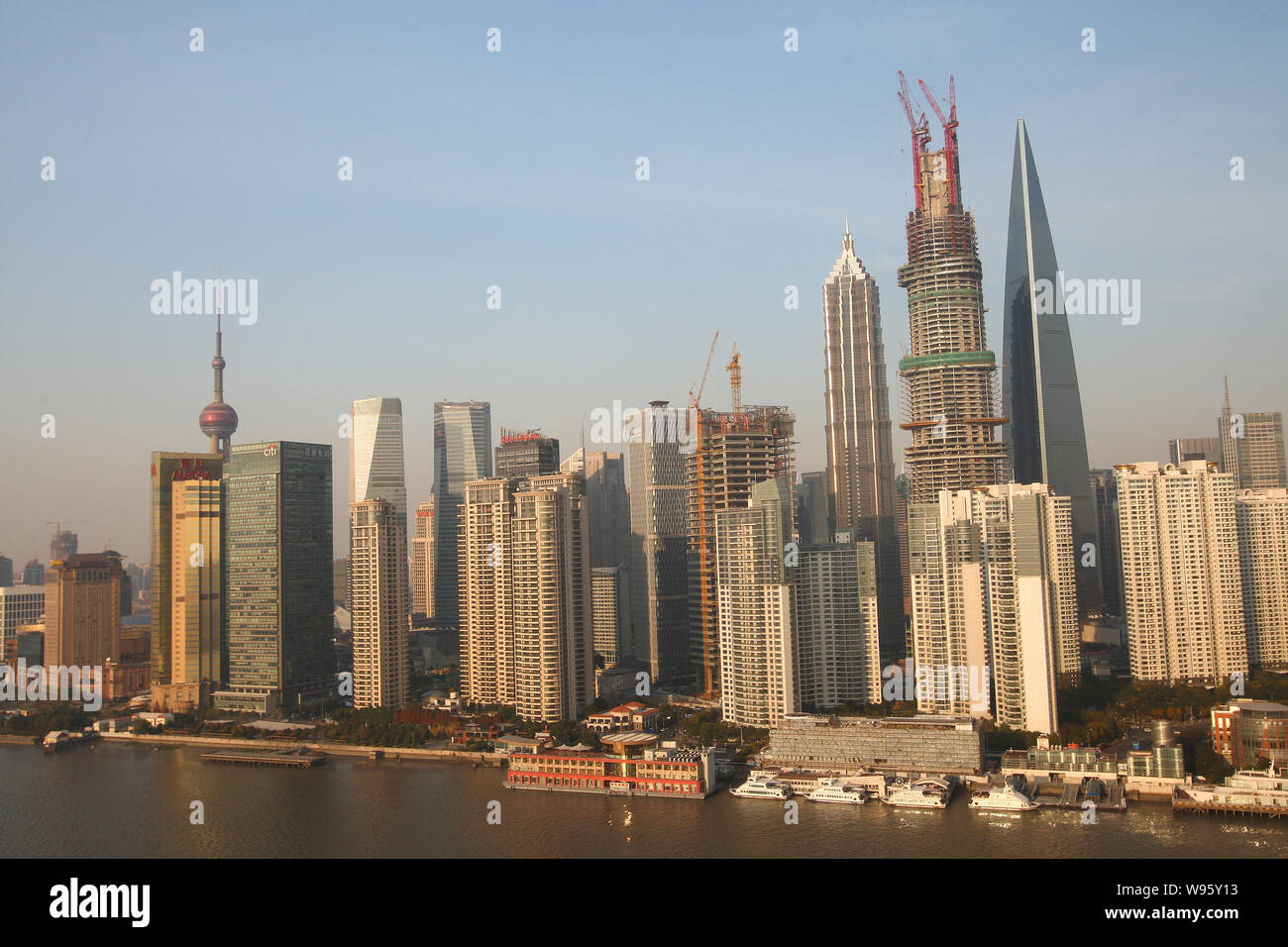 The Shanghai Tower (center) is under construction next to Jinmao Tower ...