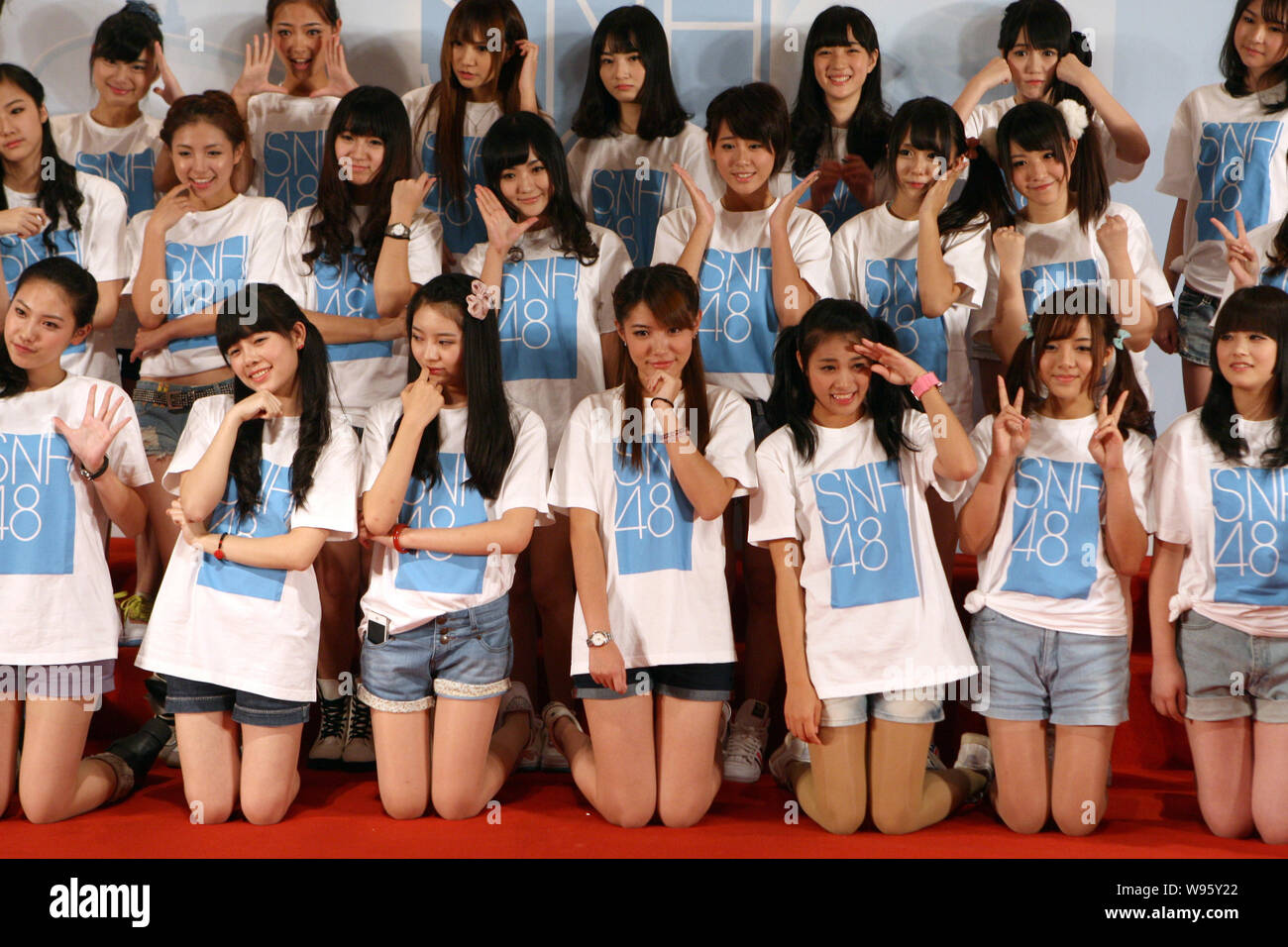 Young girls of Chinese pop group SNH48 attend a ceremony in Shanghai ...