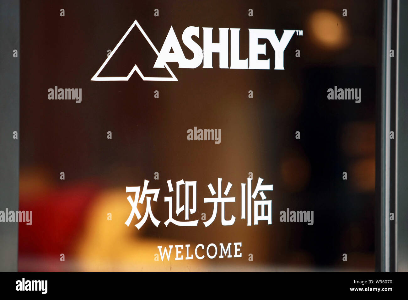 The signage of Ashley is seen on a window at the Ashley home furnishing ...