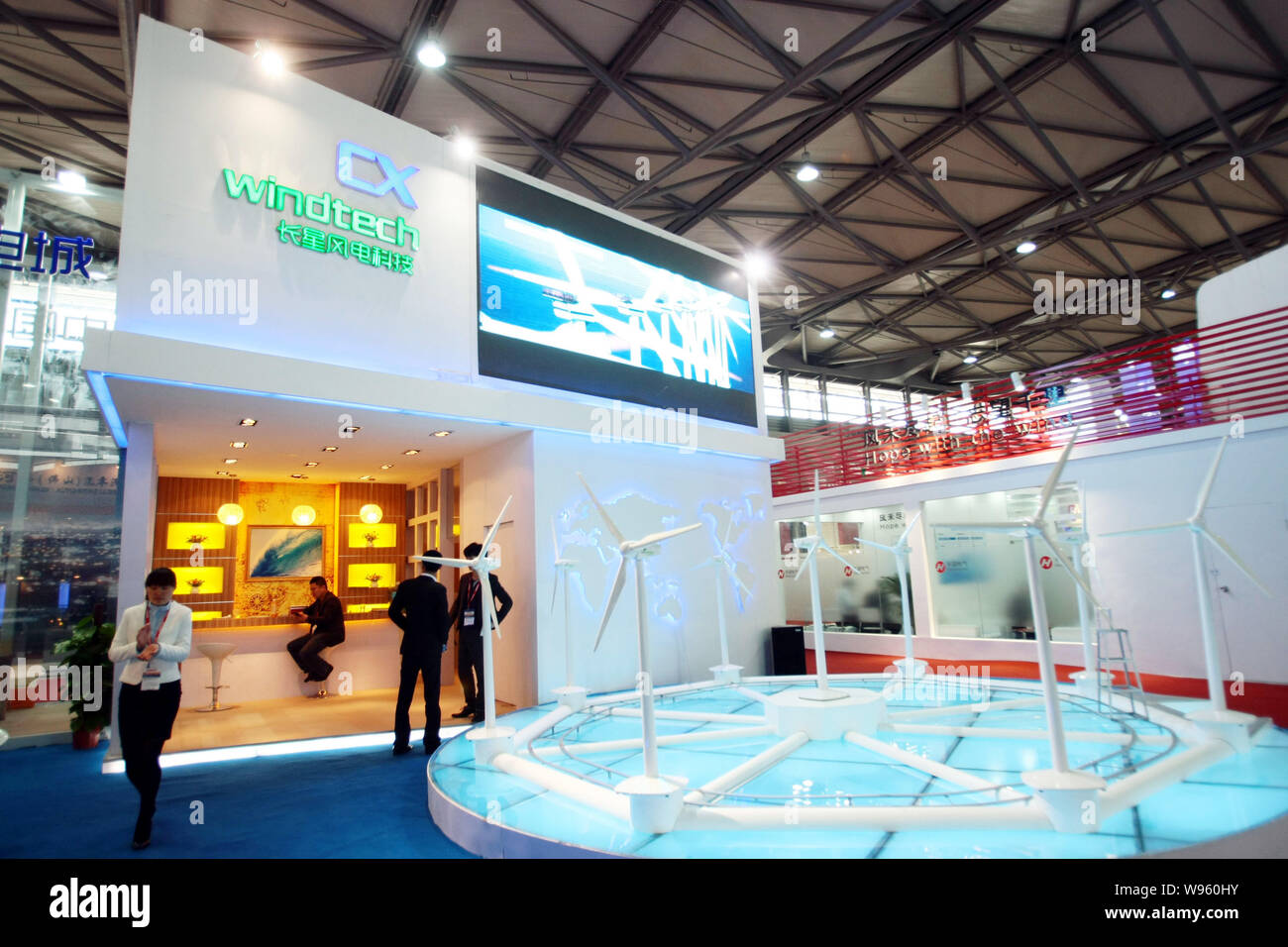 Models of wind turbines are seen on display at the stand of Shandong ...