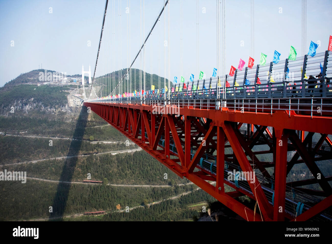 Visitors pass through Aizhai Suspension Bridge in Aizhai town, Jishou ...