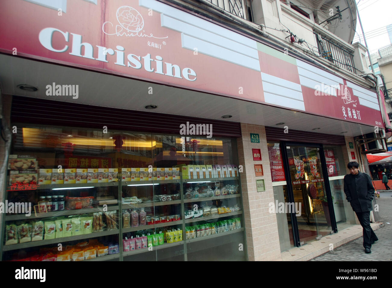 A pedestrian walks past a Christine chain bakery in Shanghai, China, 30 ...