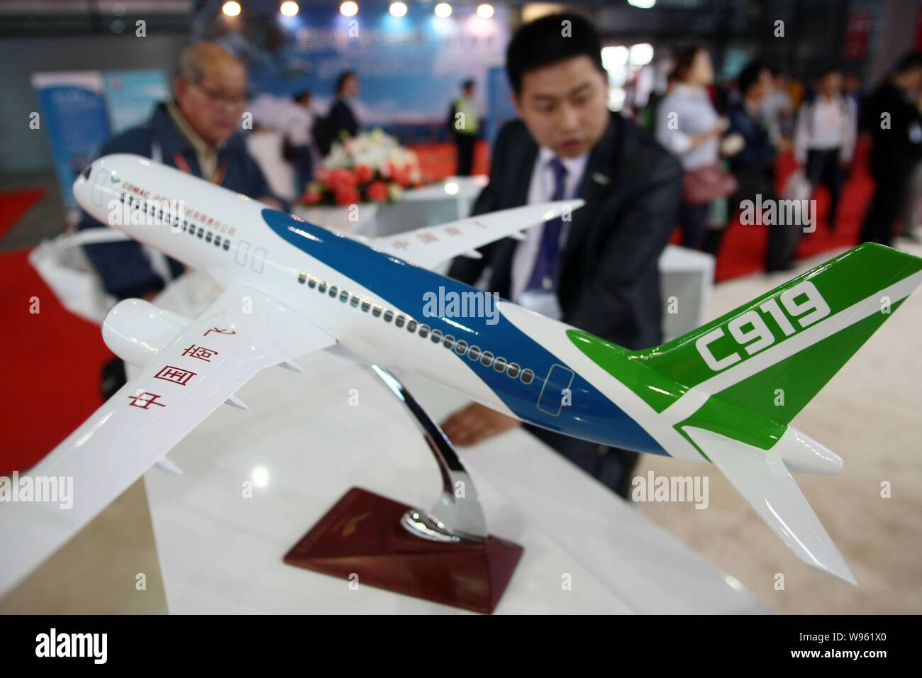 --FILE--Visitors look at a model of Chinese developed C919 jet plane of ...
