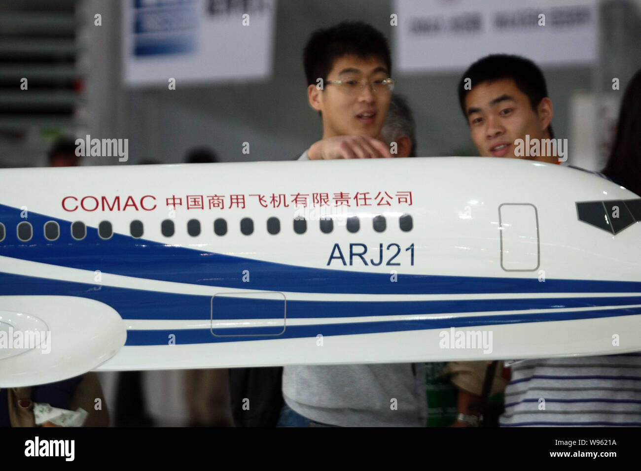 --File--Visitors look at a model of ARJ21 airplane of Commercial ...