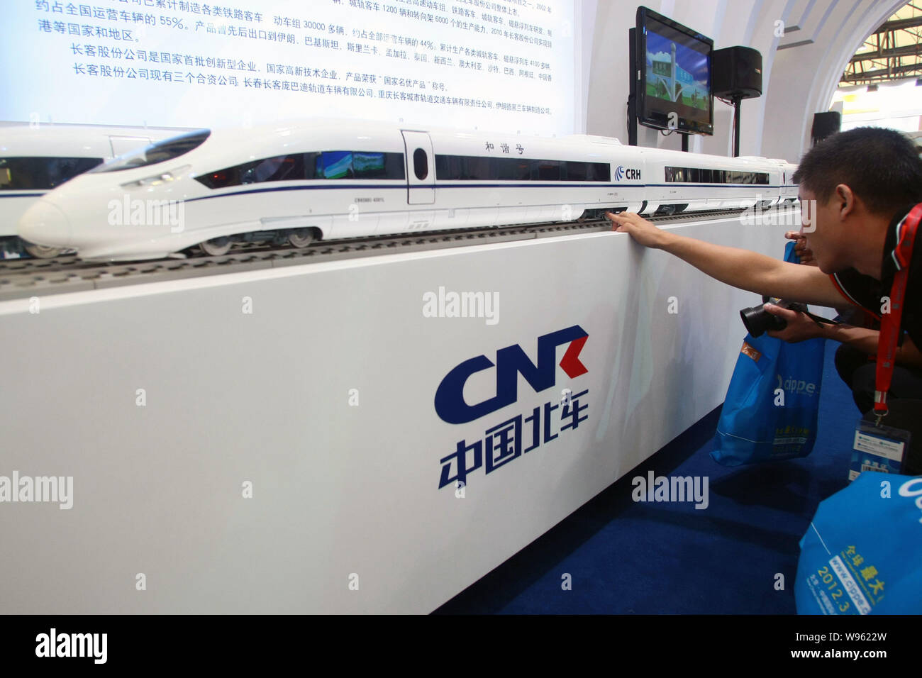 --File--Visitors look at models of CRH (China Railway High-speed ...