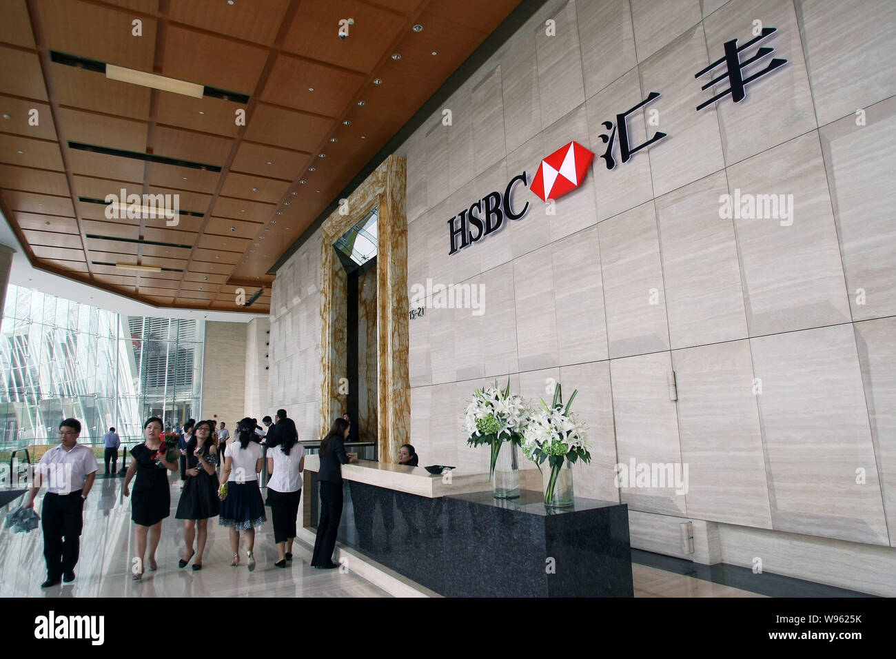 --File--Staff are pictured at the headquarters of HSBC in Shanghai ...