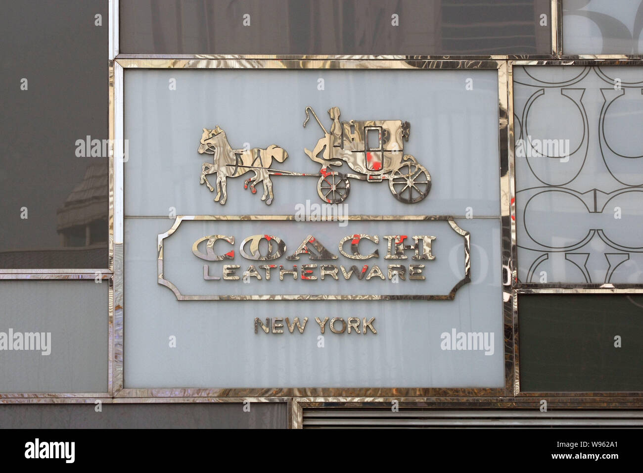 A sign of Coach leatherware is pictured outside a Coach store in ...