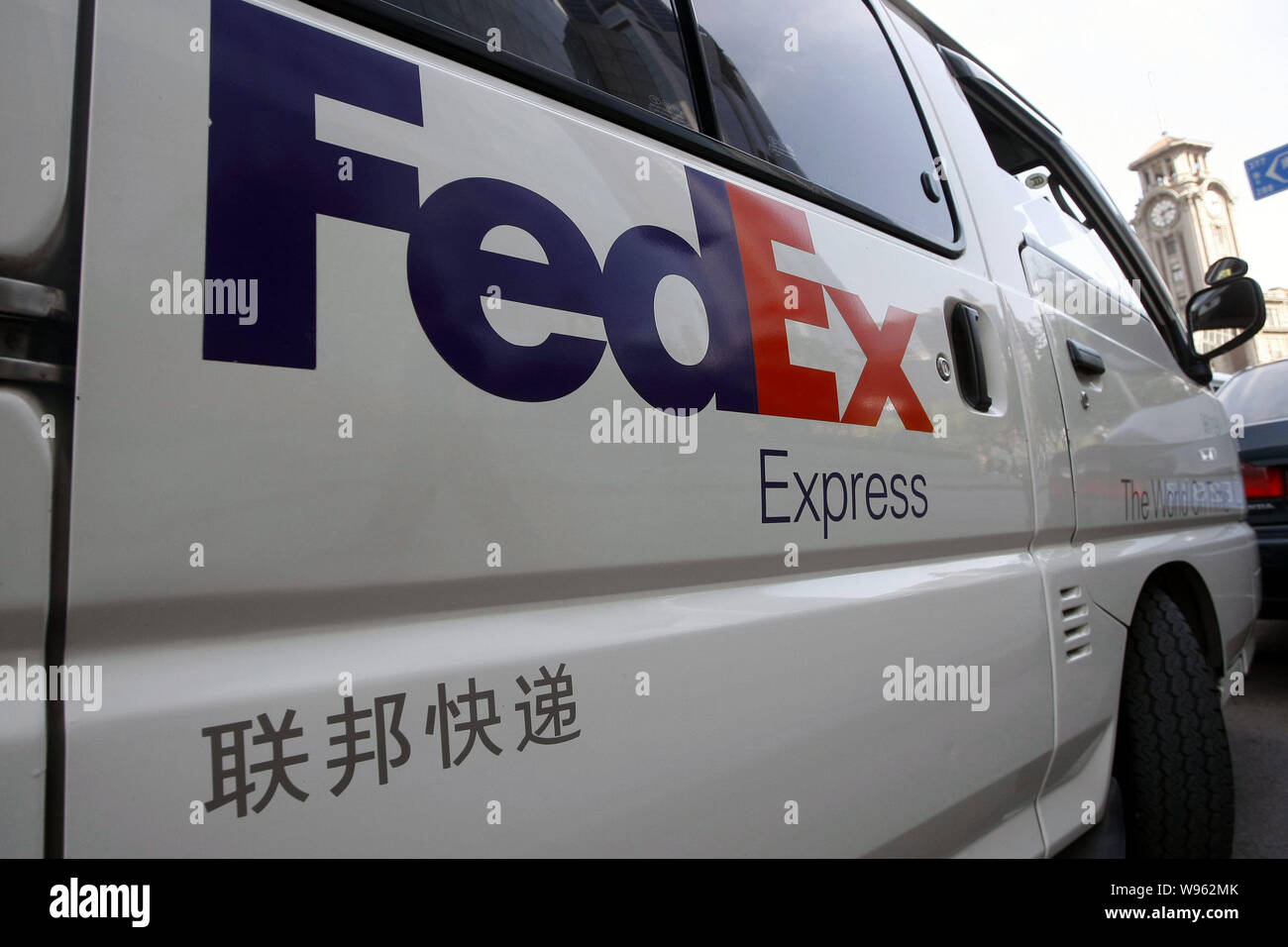 --FILE--A FedEx Express delivery car travels on the road in Shanghai ...