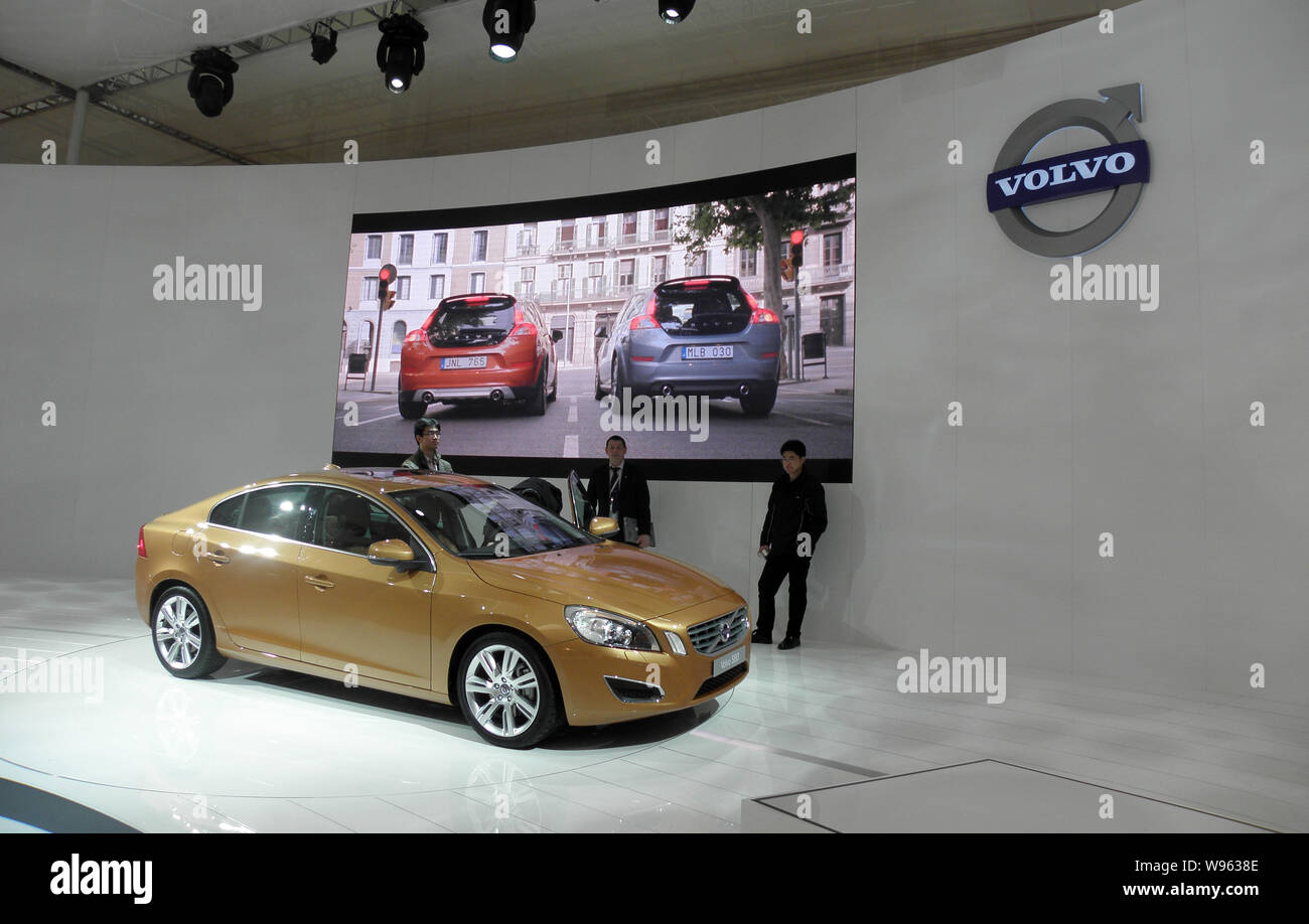 --File--Visitors look at a Volvo car during an auto show in Beijing ...