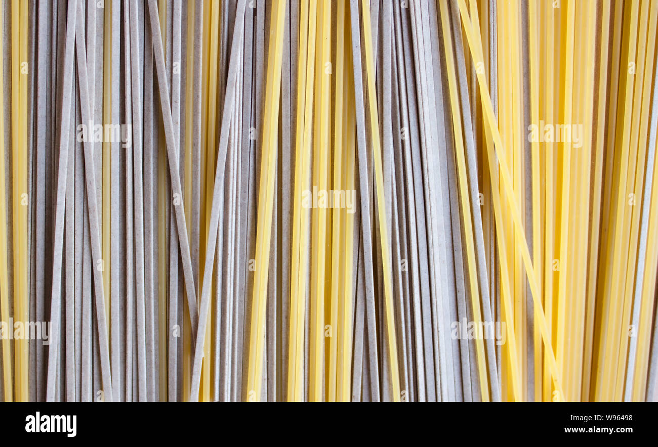 Classic Italian spaghetti and asian soba on kraft paper background ...