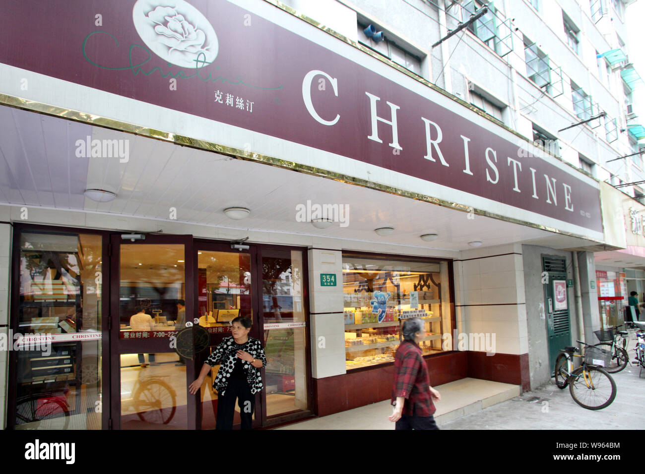 --FILE--Customers walk out from a Christine chain bakery in Shanghai ...