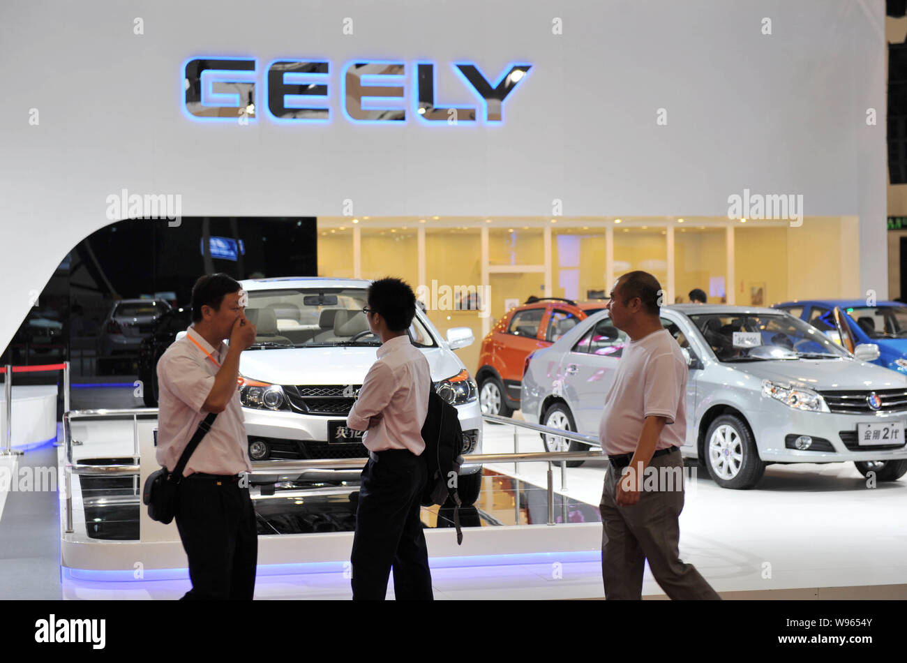 --File--Visitors look at Geely cars at the stand of Geely during an ...