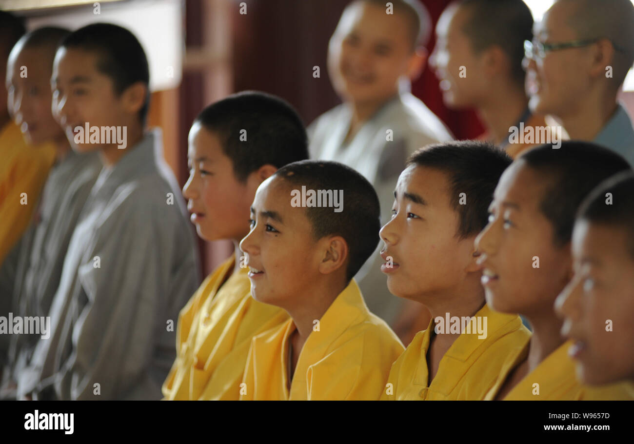 Chinese Buddhist monks and nuns of Guangxuan Art Troupe practice vocal ...