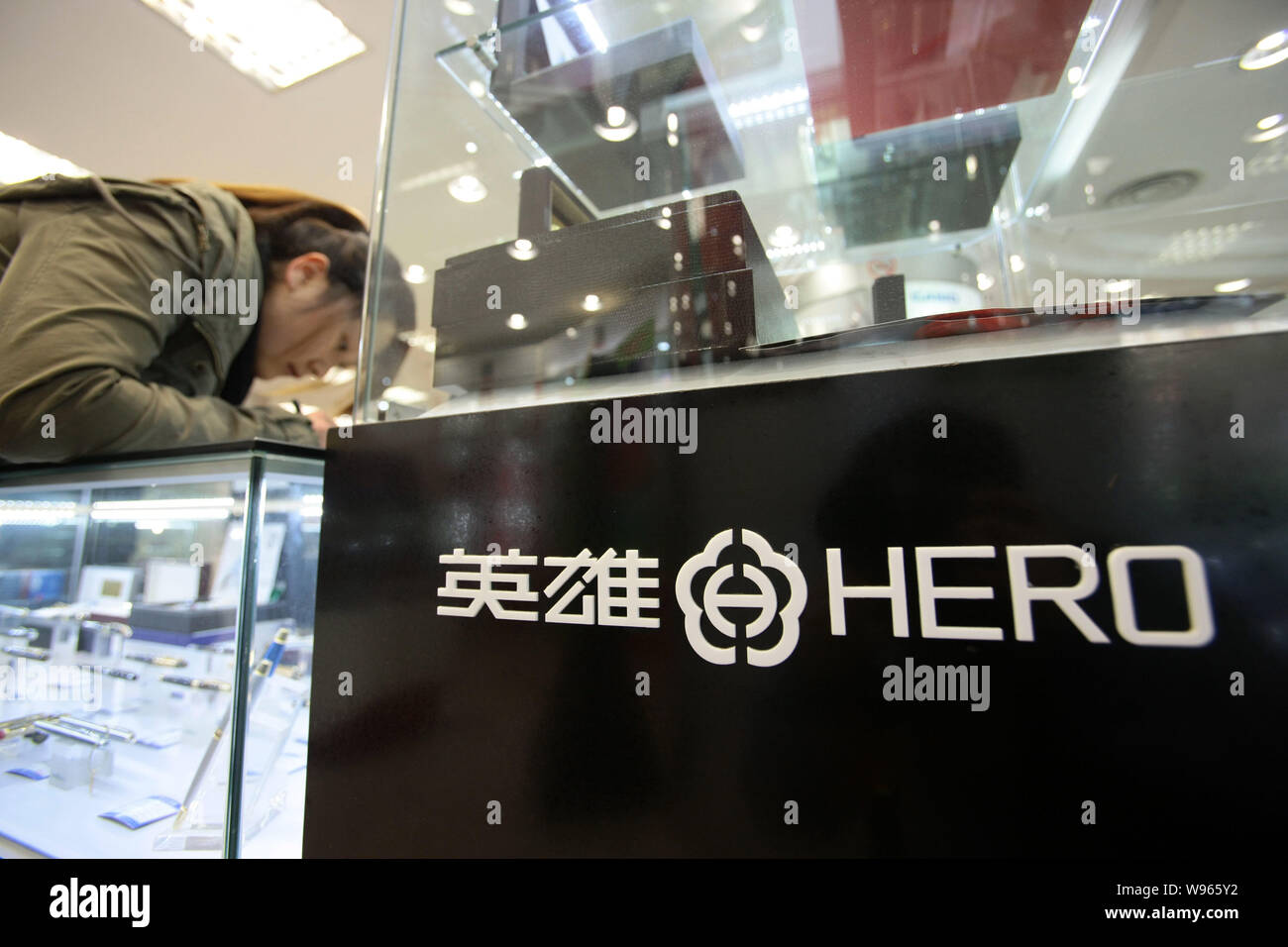A customer buys Hero pens at a store in Shanghai, China, 28 November ...