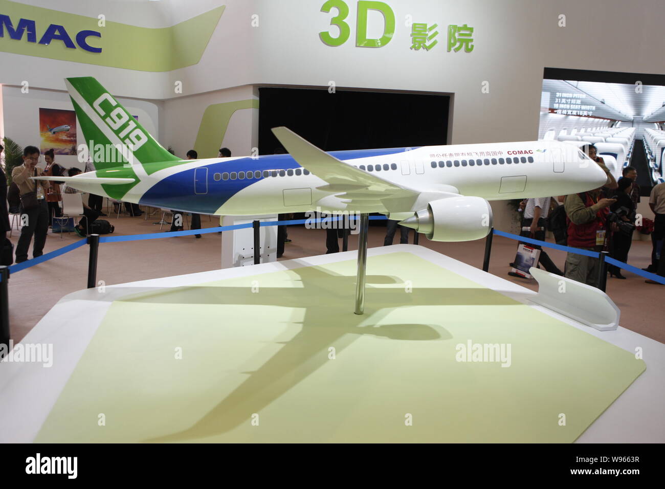 A model of the C919 passenger jet is displayed at the stand of COMAC ...