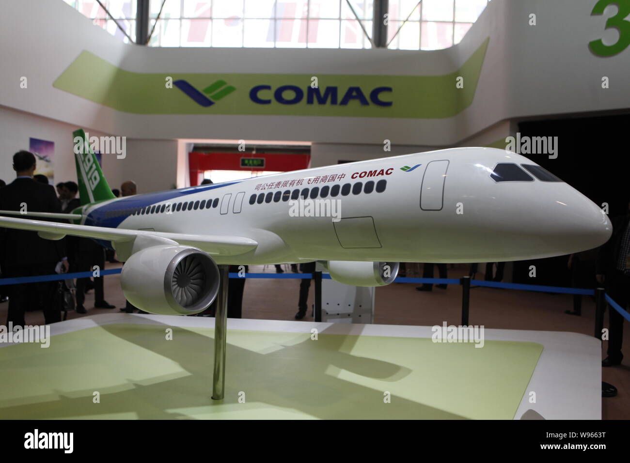 A model of the C919 passenger jet is displayed at the stand of COMAC ...