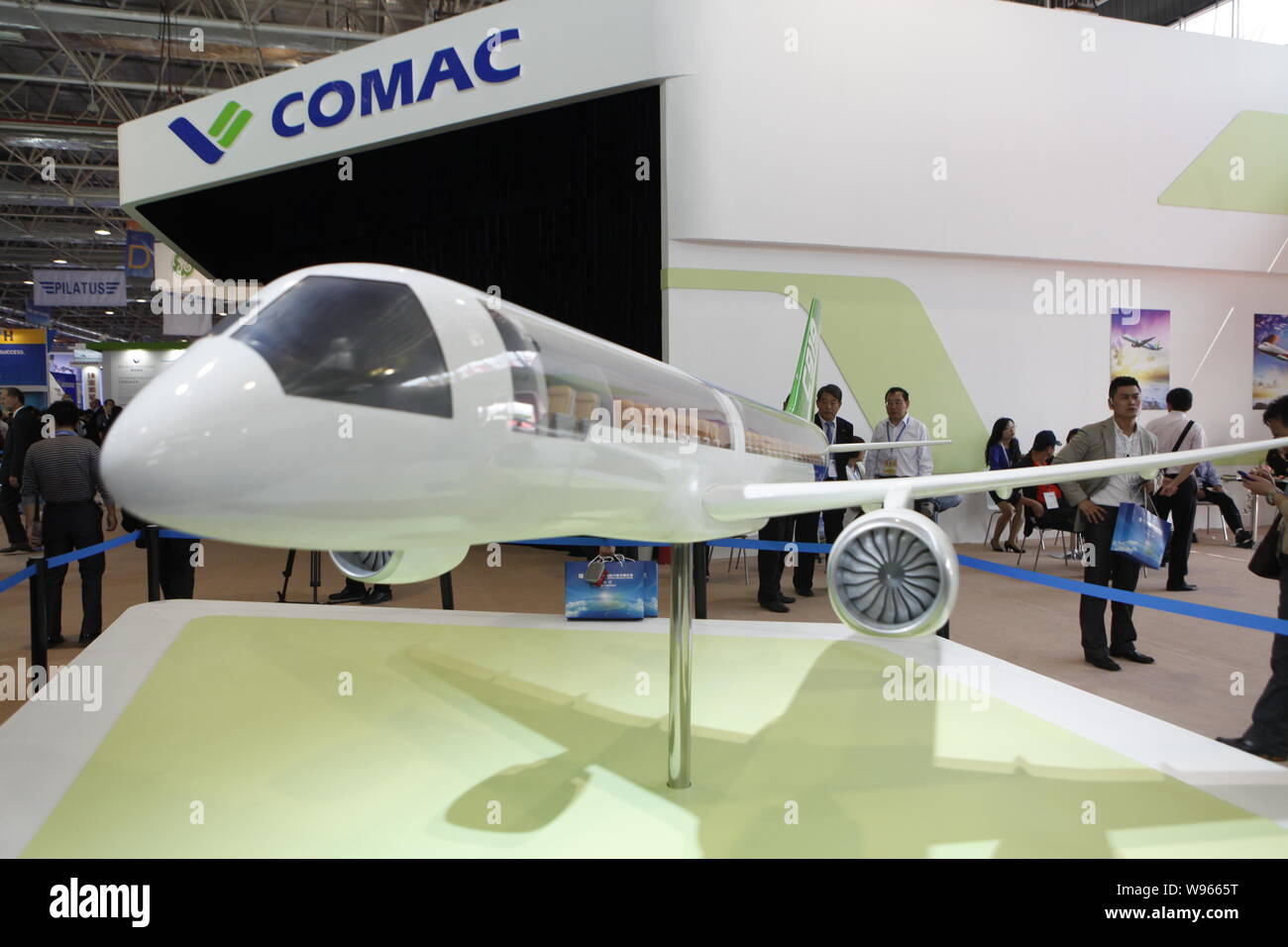 A model of the C919 passenger jet is displayed at the stand of COMAC ...