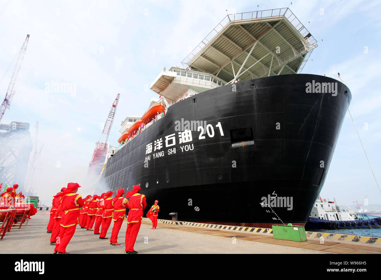 Chinese entertainers perform in front of the newly-built deepwater ...