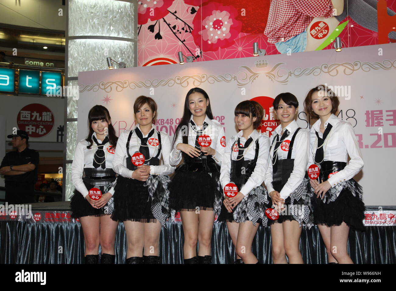 Members of Japanese girl group SDN48 pose during a handshake meeting in Hong Kong, China, 2 ...