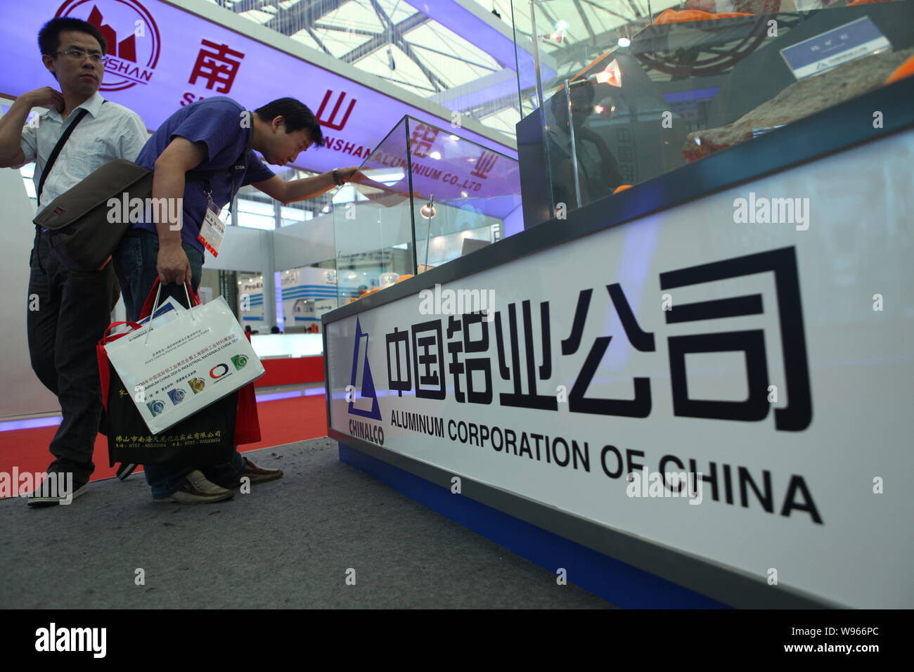 --FILE--People visit the stand of Chinalco (Aluminum Corporation of ...