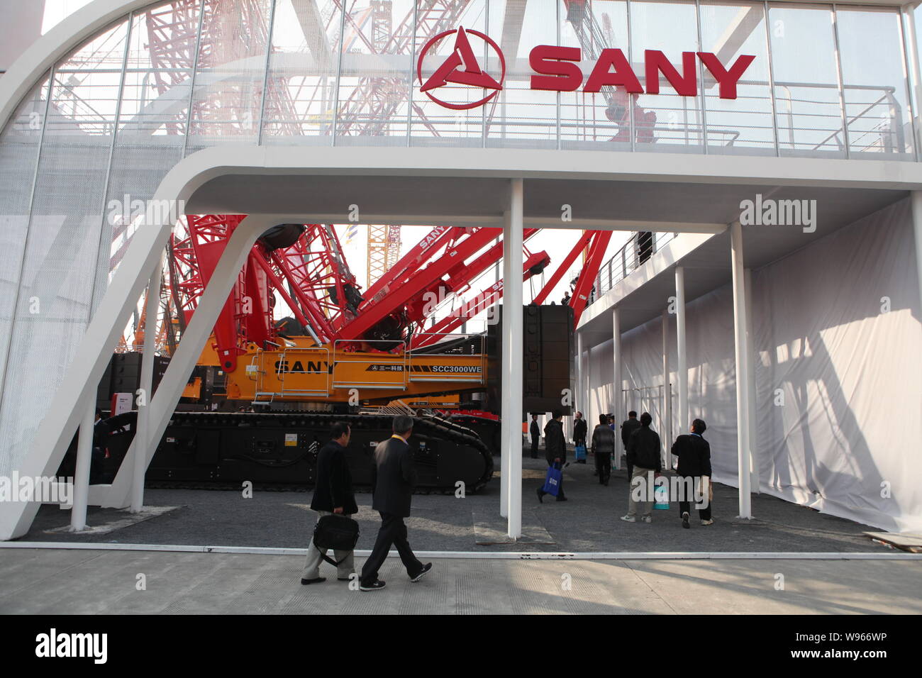 --File--Visitors look at construction vehicles at the stand of Sany ...