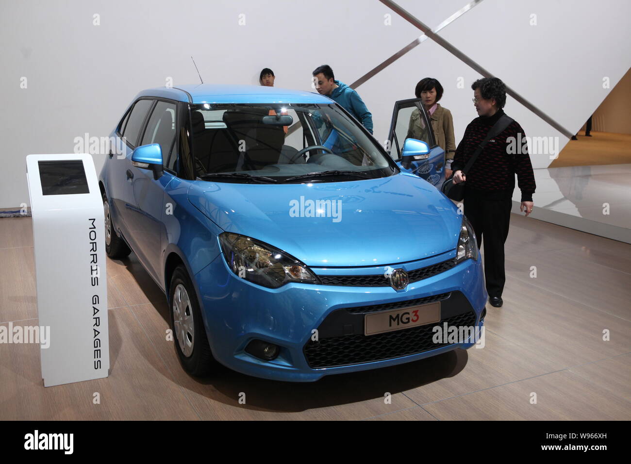 --FILE--Visitors look at an MG3 of SAIC Motor during the 14th Shanghai ...