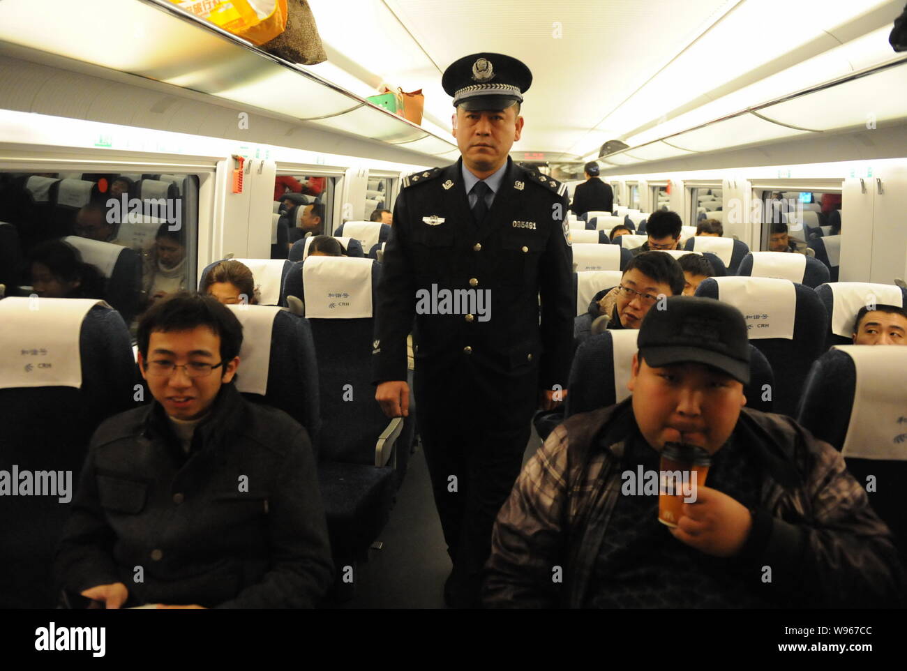 A railway policeman is on his patrol duty in G502 CRH (China Railway ...
