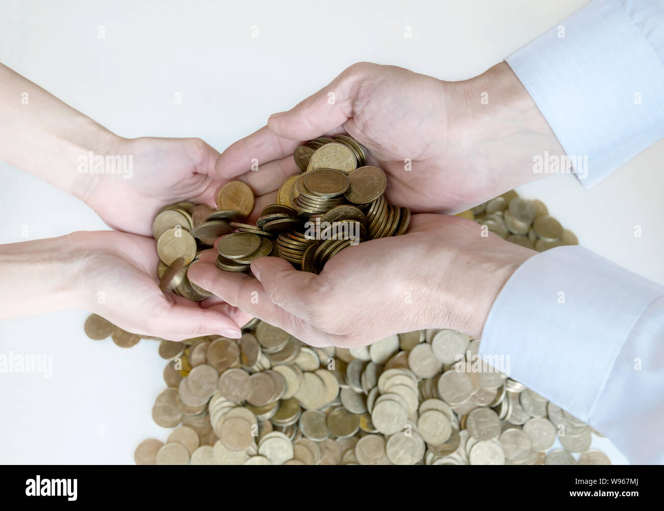 Giving a lot of coins hi-res stock photography and images - Alamy